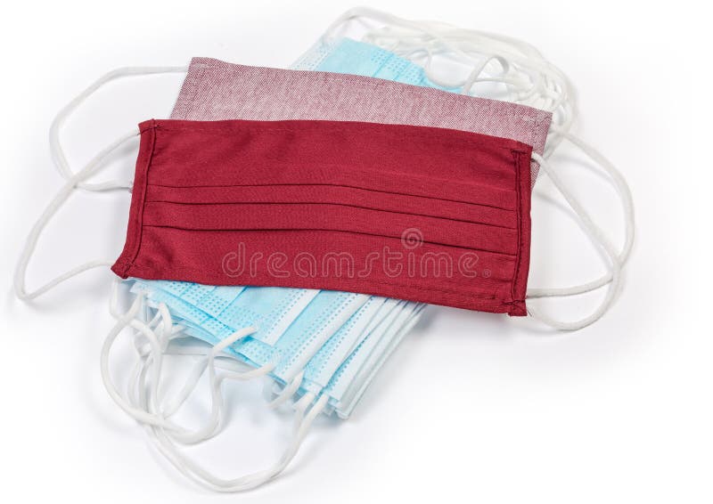 Red Fabric Protective Face Masks Lie on the Medical Masks Stock Photo ...