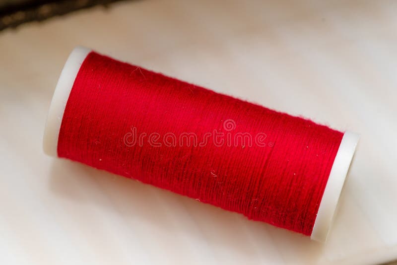 Red Fabric Sewing Thread Roll with Visible Lines. Stock Photo - Image ...