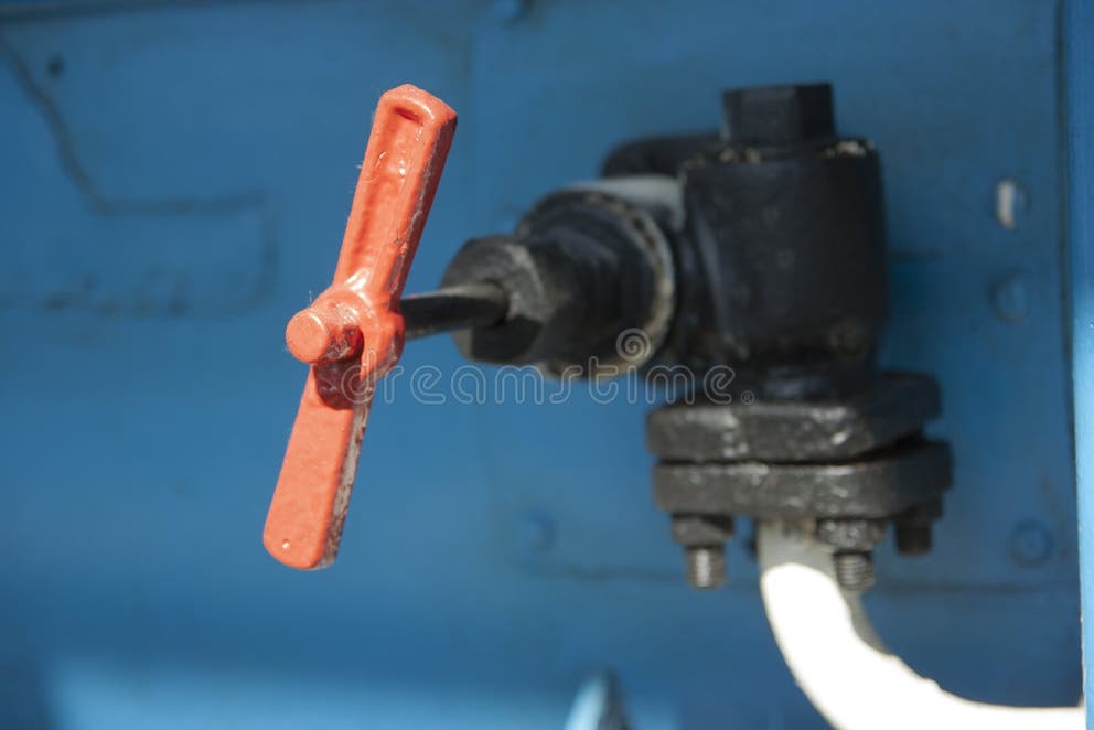 Red faucet on the tube stock image. Image of sign, symbols - 48652105