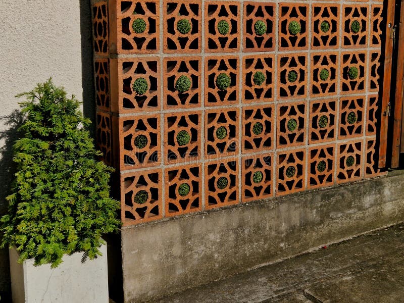 Red Fence Around the Garden Built of Burnt Clay Bricks with Large Gaps ...