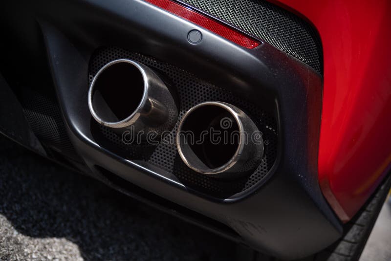Red Ferrari exhaust stock image. Image of race, motors - 268756337