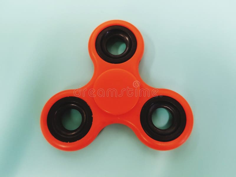 Red fidget spinner stock image. Image of fidget, shot - 96166927