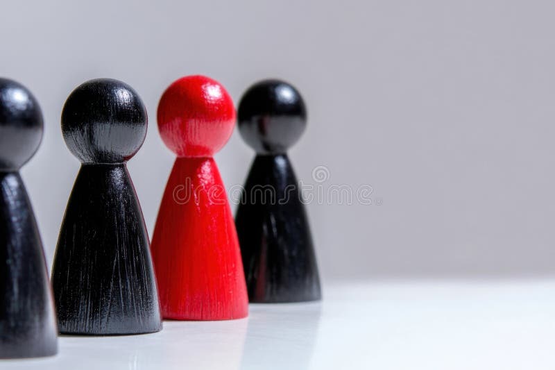 Red Figure Stands Out among Black Figures on a Bright Surface ...