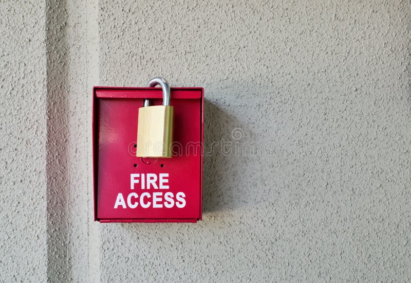 Red Fire Access Box with Padlock on a Plain Textured Wall. Stock Image ...