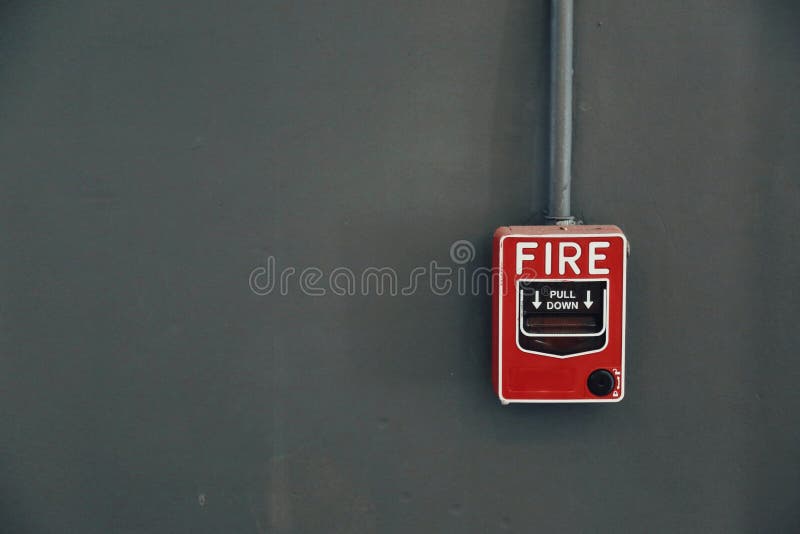 A Red Fire Alarm Pull Station on the Grey Wall. Stock Photo - Image of ...