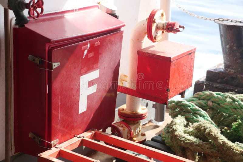 Red Fire Box and Equipment on a Ship Near the Ocean Stock Photo - Image ...