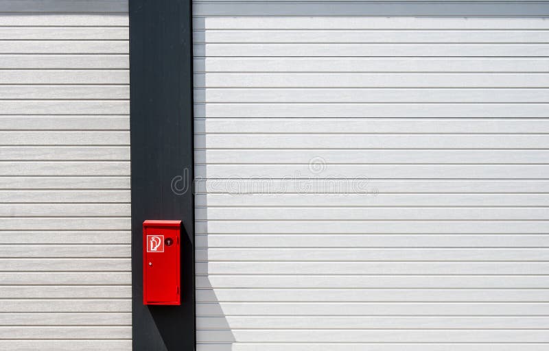 Red Fire Box Hung On A Black And White Surface With Lines - Perfect For ...