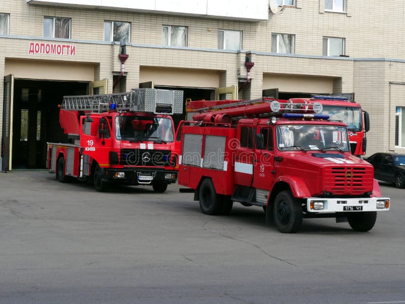 Red Fire Engines Standing at the Fire Station during the Day. Editorial ...