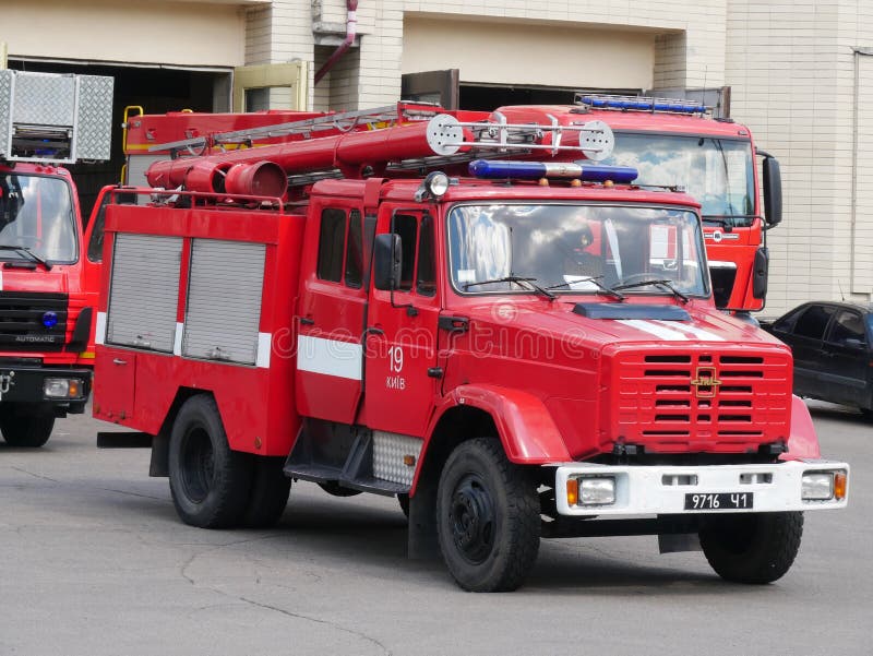 Red Fire Engines Standing at the Fire Station during the Day. Editorial ...