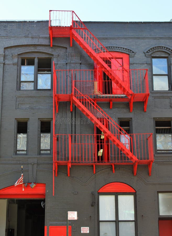 Red Fire Escape Stairs stock image. Image of door, flag - 85380645