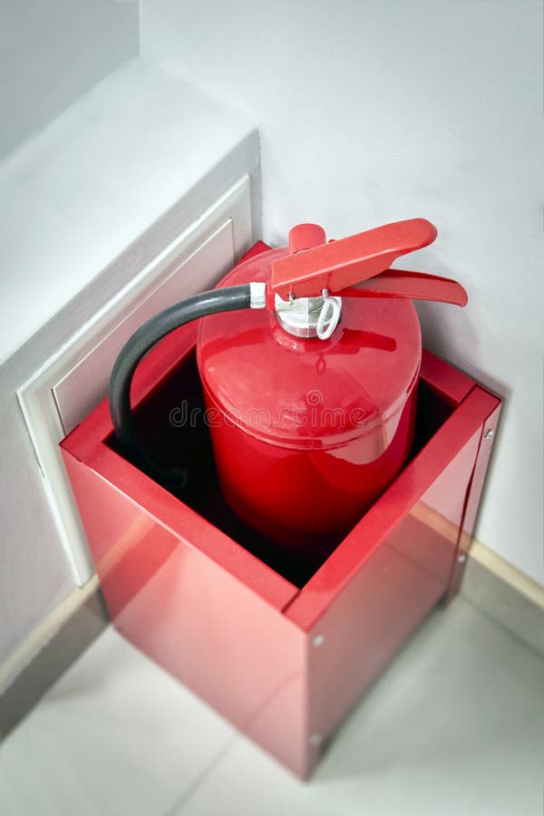 Red Fire Extinguisher in Box Against the White Wall. Stock Image ...