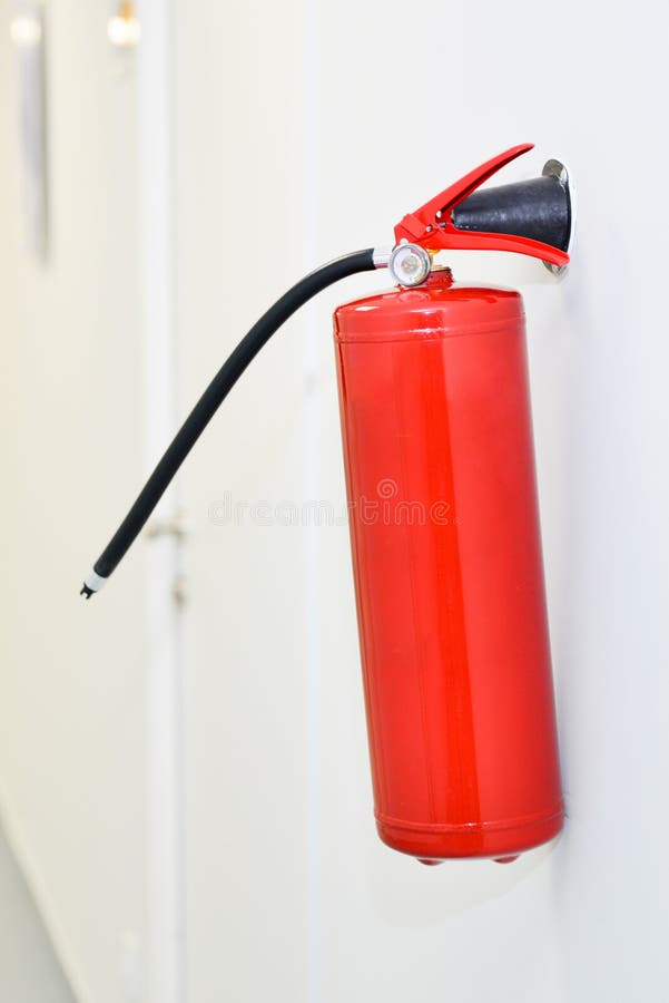 Red Fire Extinguisher. Close-up of Red Modern Fire Extinguisher in ...