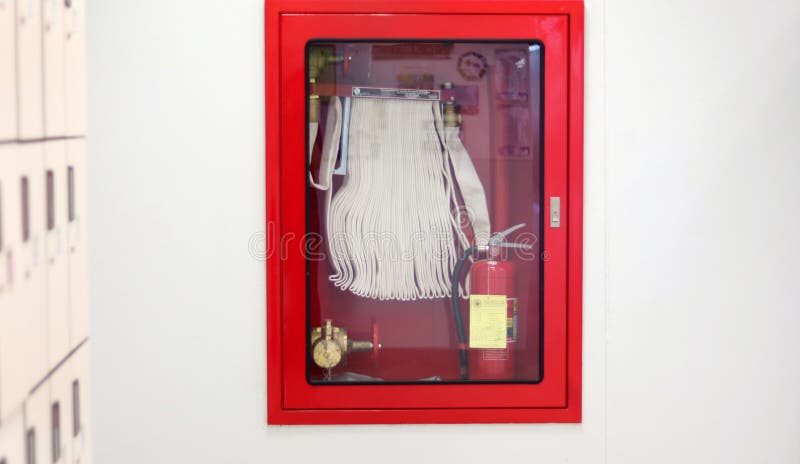 Red Fire Extinguisher and Fire Hose Reel Setting in Laboratory Walkway ...