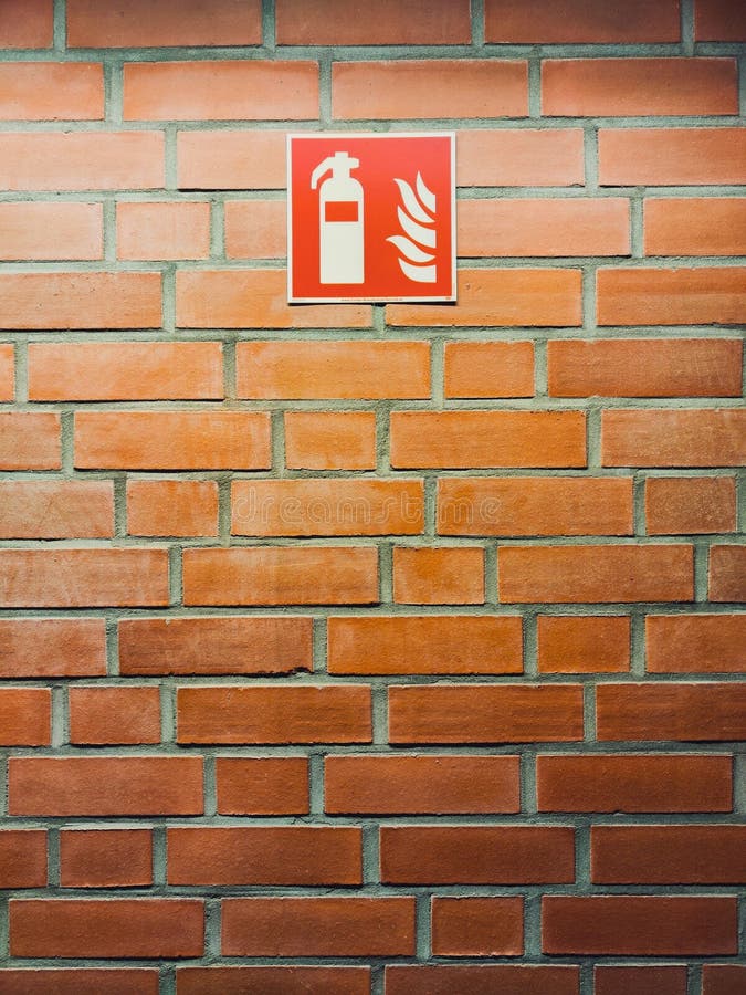 Red Fire Extinguisher Sign on a Brick Wall Stock Photo - Image of ...