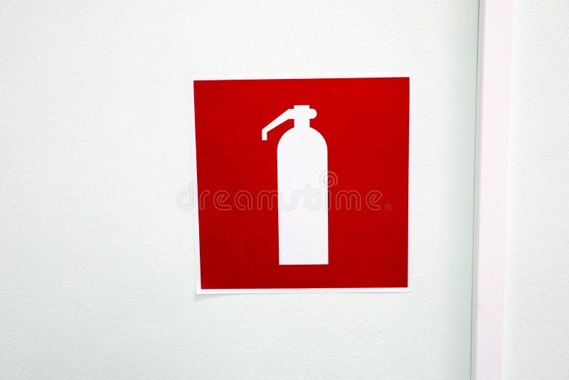 Red Fire Extinguisher Sign on the White Wall Stock Image - Image of ...