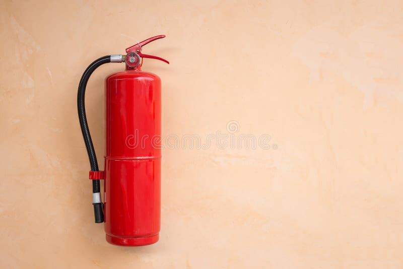 Red Fire Extinguisher Tank on Orange Wall Stock Image - Image of heat ...