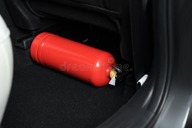 Red Fire Extinguisher in Trunk. Car Safety Equipment Stock Photo ...