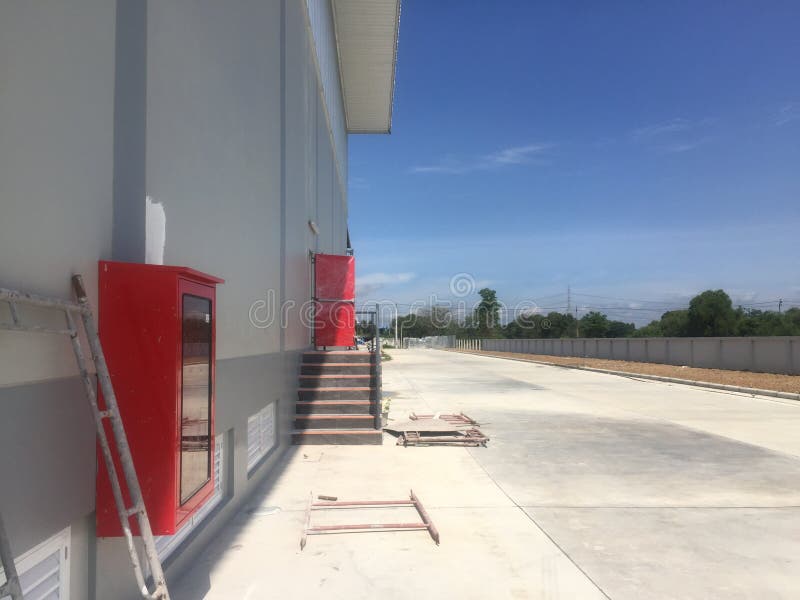 Red Fire Hose Cabinet Extinguisher by the Wall with Blue Sky Stock ...