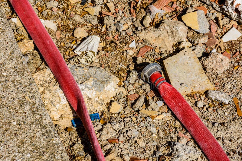 Red Fire Hose with Fitting on the Ground Stock Image - Image of detail ...