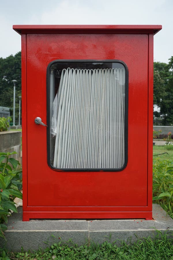 A Red Fire Hydrant Box, in the Afternoon in the Garden Courtyard in the ...