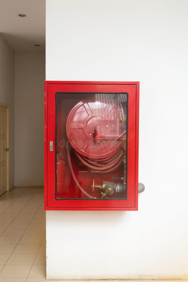 A Red Fire Hydrant in a Clear Glass Case is Mounted on a White Wall ...