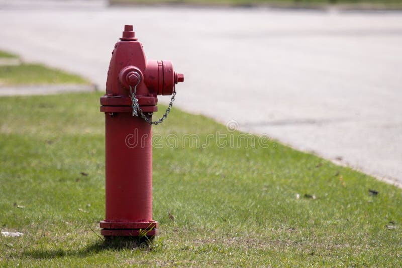 A Red Fire Hydrant by the Street Stock Photo - Image of lawn, tower ...