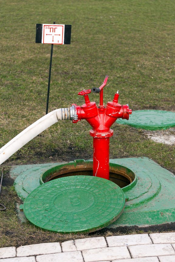 Red Fire Hydrant Stands in Manhole Stock Image - Image of rescue ...