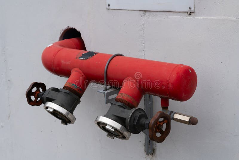 Red Fire Hydrant on White Wall. Close-up. Stock Image - Image of ...