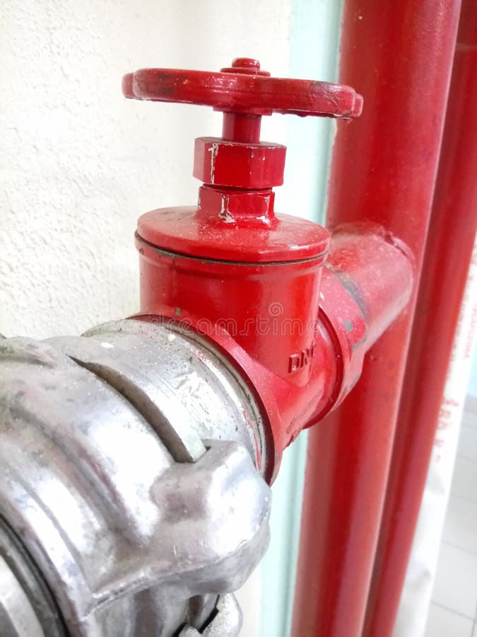 Red fire pipe with tap stock photo. Image of flame, hydrant - 189960922