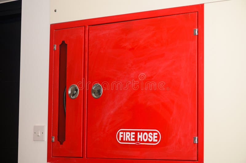 Red Fire Shield with Fire Extinguisher in a Business Center. Stock ...