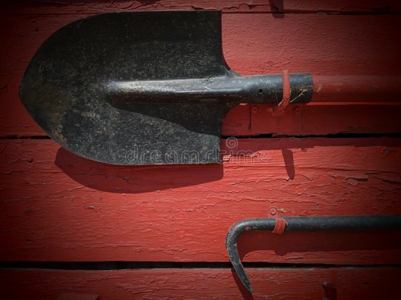A Red Fire Shield with a Tool Hanging on it for Firefighters Stock ...