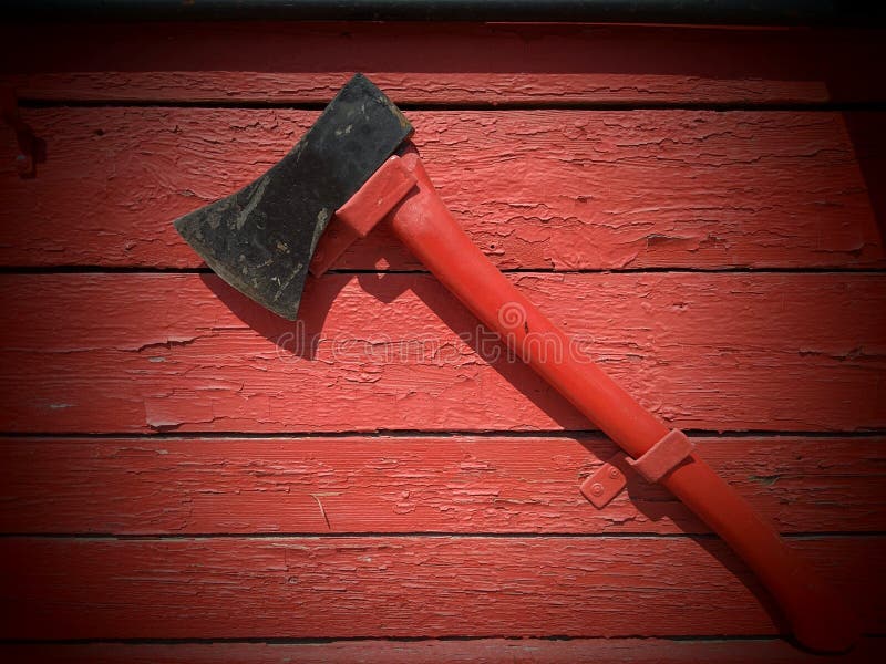 A Red Fire Shield with a Tool Hanging on it for Firefighters Stock ...