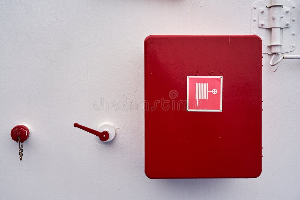 A Red Fire Shield on a White Wall on a Ship Stock Image - Image of ...