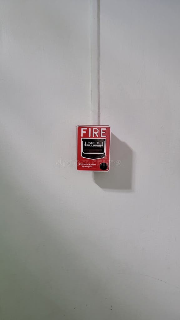 Red Fire Switch on the Wall Stock Photo - Image of label, black: 274658010