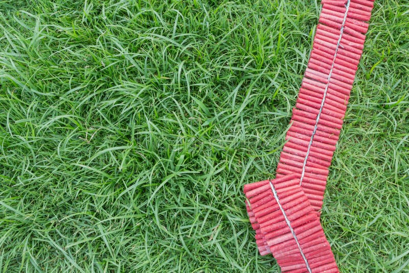 Red Firecrackers on Green Lawn Stock Photo - Image of rocket, noisy ...