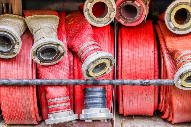 Fire Hoses on a Fire Engine Truck Stock Photo - Image of engine, rolled ...