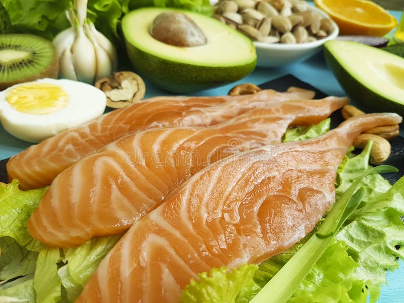 Red Fish, Avocado on Blue Wooden Stock Photo - Image of composition ...