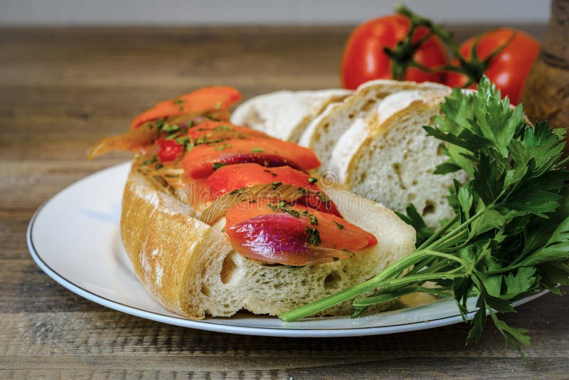 Red Fish Cut into Pieces on a Large Piece of Bread on a Plate with ...