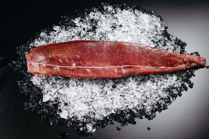 Red fish fillet on ice stock image. Image of explosion - 283938349