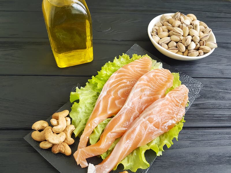 Red Fish, Oil Nuts on the Wooden Stock Photo - Image of food, cutting ...