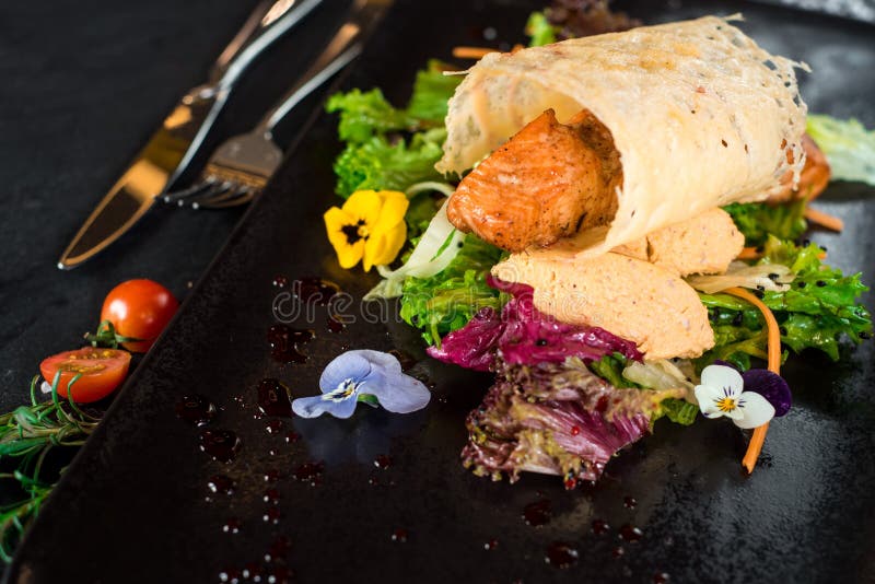 Red Fish Steak in Pita and Vegetables on Black Stock Photo - Image of ...