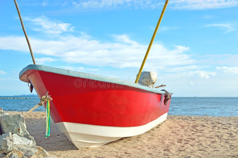 Red Fishing Boat on the Beach Stock Photo - Image of rope, nautical ...