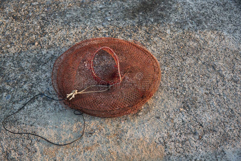 A Red Fishing Net on the Ground Stock Photo - Image of fishnet, catch ...