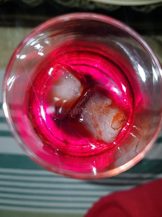Red Fizzy Drink in Glass with Ice Cubes Stock Photo - Image of drink ...
