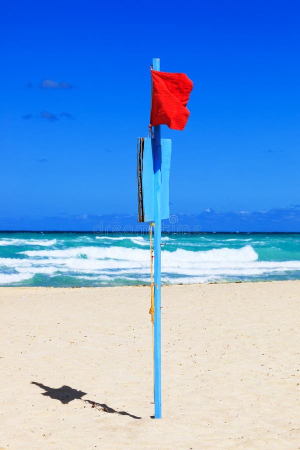 Red flag on beach stock image. Image of surf, locations - 41386209