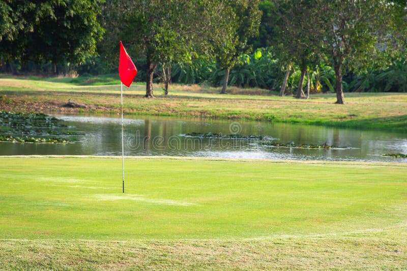 Red Flag in the Beautiful Golf Course and Pond Stock Image - Image of ...