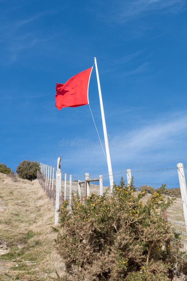 Red flag stock image. Image of pole, range, wind, flagpole - 242434691