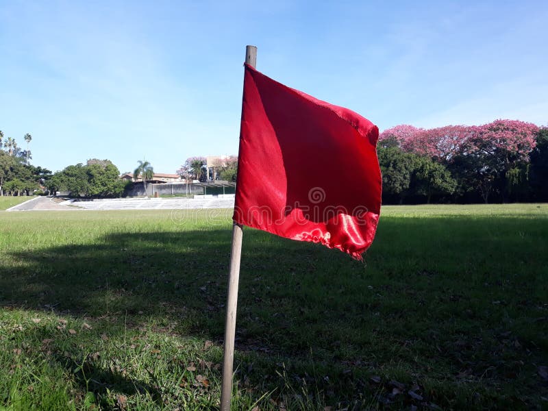 Red flag fluttering stock photo. Image of field, flag - 146000936
