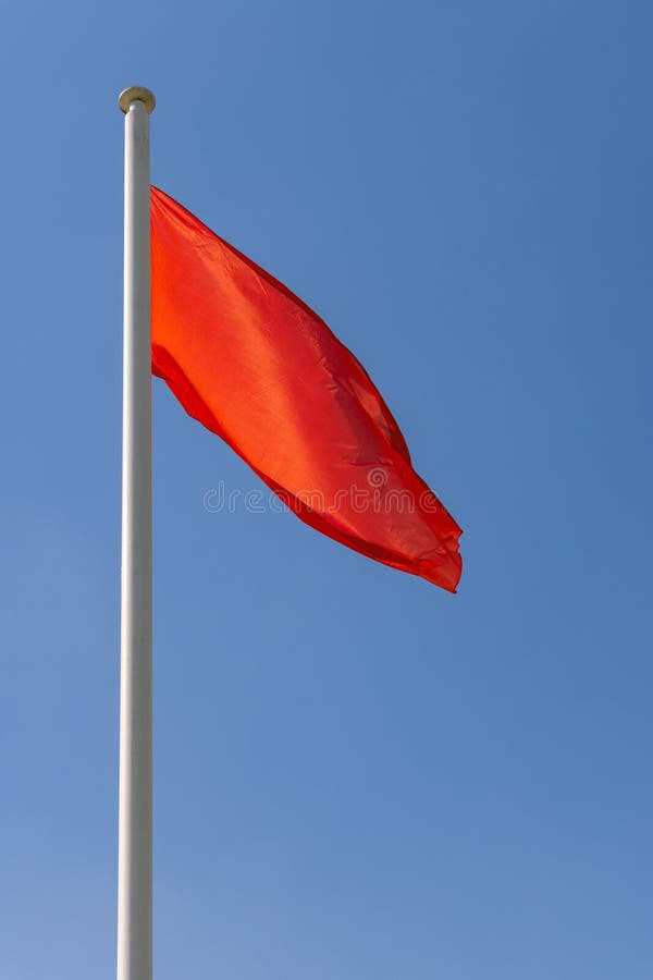 Red Flag at Pole stock image. Image of literal, blue - 365790739