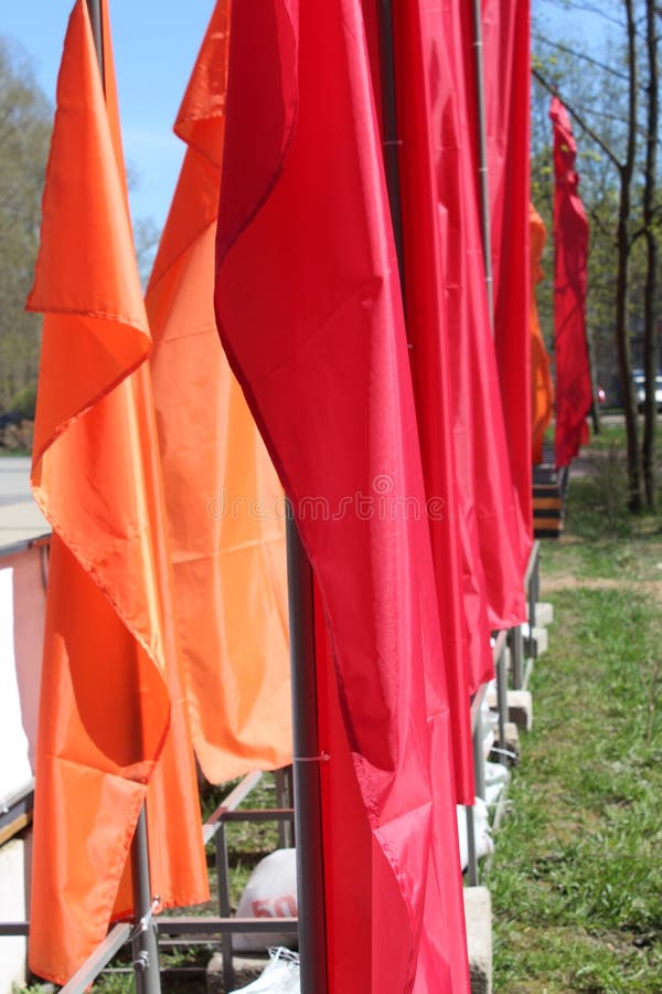 Red Flags Fluttering in the Park for Holiday Stock Image - Image of ...